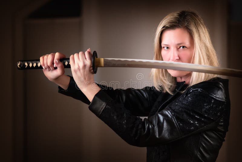 Female fighter with sword stock photo. Image of girl - 132743132
