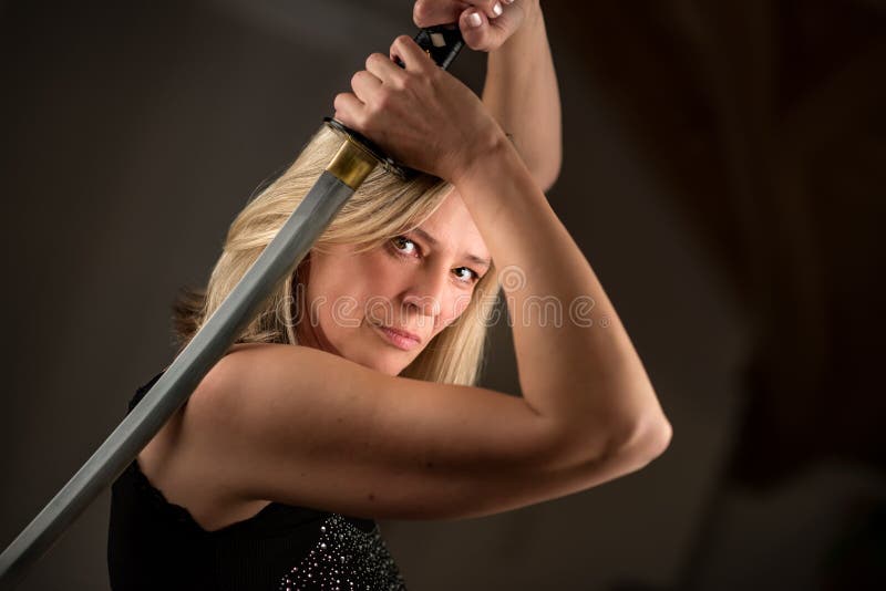 Female fighter with sword stock photo. Image of human - 132743422