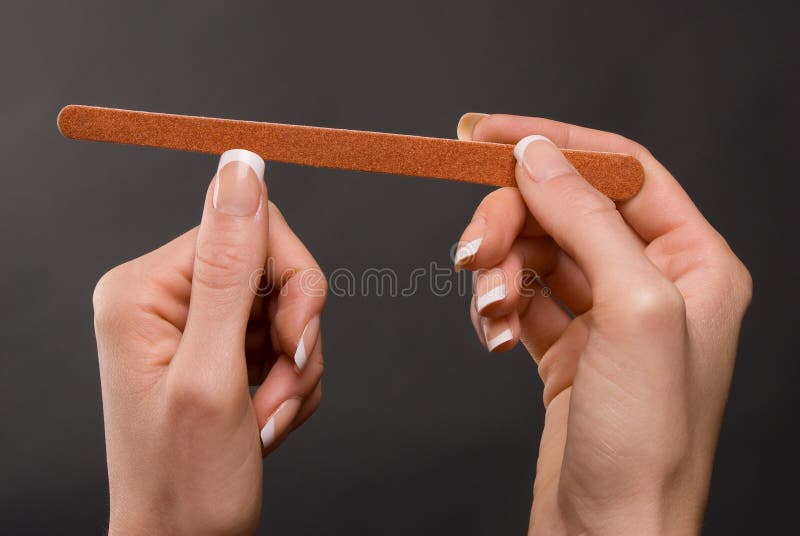 Female filing nails stock photo. Image of hands, woman - 10044102