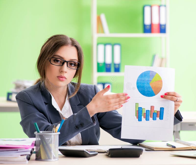 Female Financial Manager Presenting Graph Chart Sitting in the O Stock ...