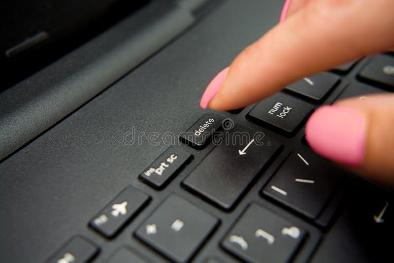 Female Finger Presses Delete Button on Black Laptop Stock Image - Image ...