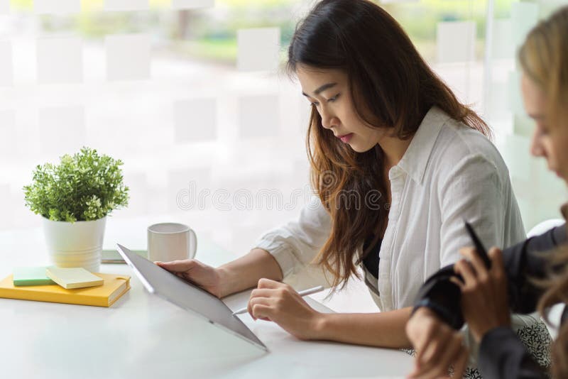 Female Focused on Her Work with a Tablet Computer Stock Photo - Image ...