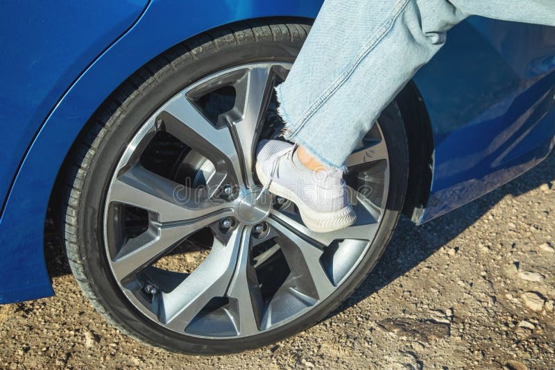 Female foot on car wheel stock photo. Image of fashion - 355176048