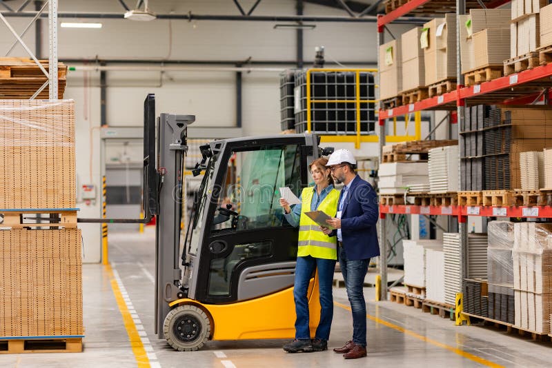 Female Forklift Driver, Warehouse Worker Talking with Manager, Standing ...
