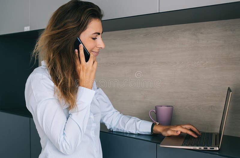 Female Freelancer Standing and Working on Laptop Stock Photo - Image of ...