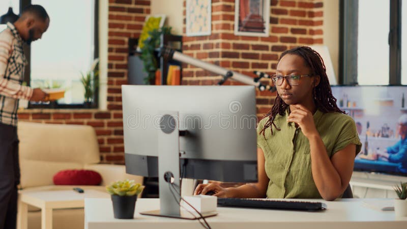 Female Freelancer Using Computer To Work on Business Report Stock Photo ...