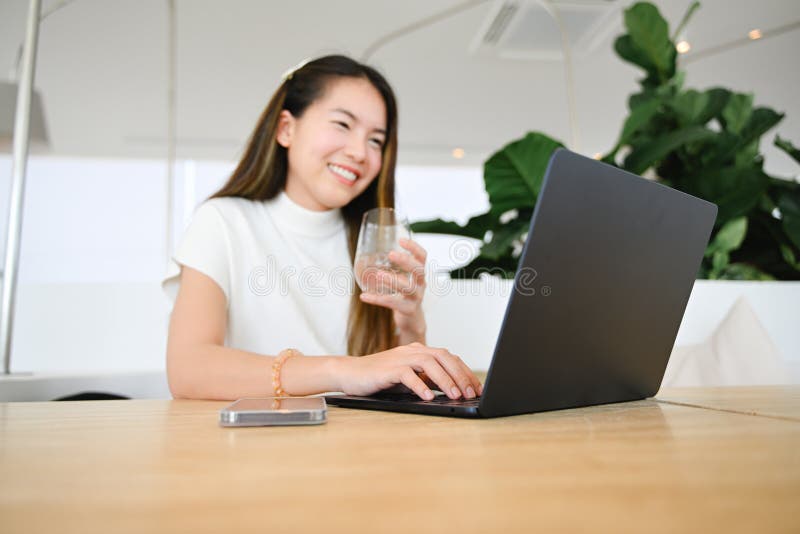 A Female Freelancer is Working Using a Laptop on a Working Plane. the Photo is of High Quality ...