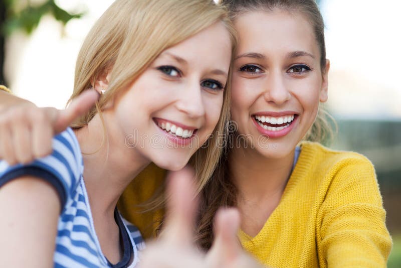 Female friends stock photo. Image of teenagers, thumbs - 26871250