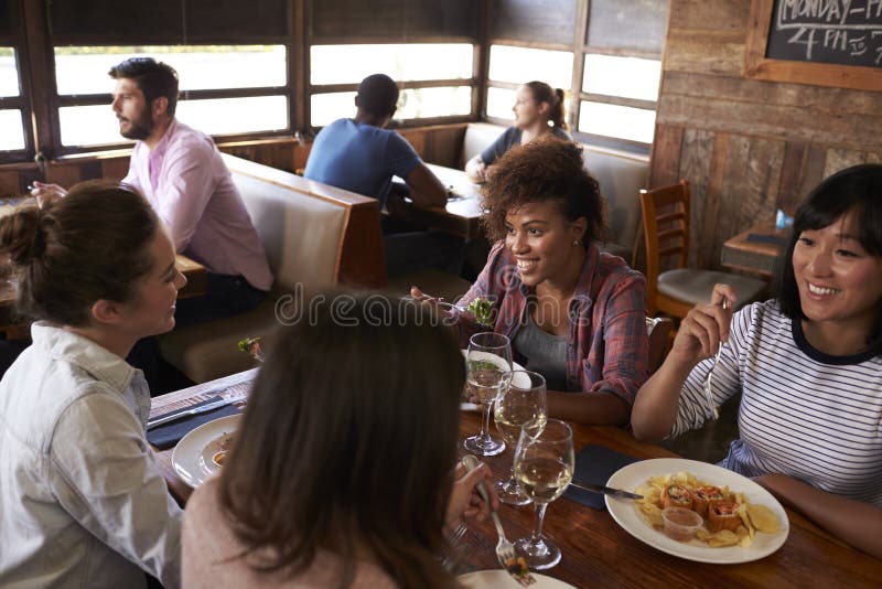 Female Friends Enjoying Lunch at a Restaurant, Elevated View Stock ...