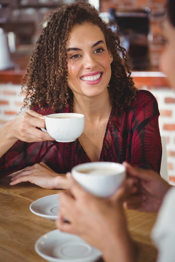 Female Friends Having Coffee Stock Photo - Image of attractive, plate ...