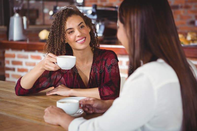 Female Friends Having Coffee Stock Photo - Image of happy, indoors ...