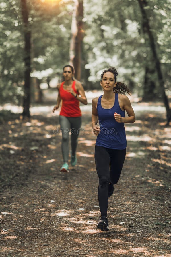 Female Friends Jogging Outdoors Stock Image - Image of caucasian ...