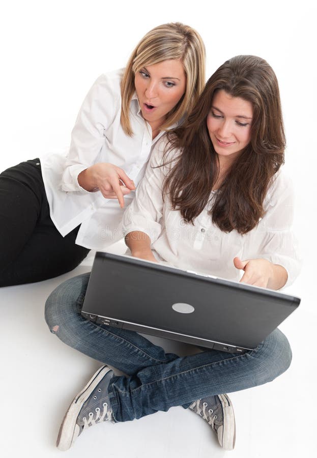 Female friends with laptop stock image. Image of playing - 45121459