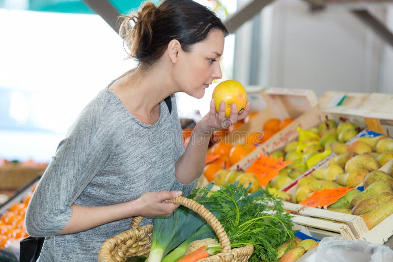 Female Fruit Client Smelling Fruit Stock Image - Image of supermarket ...