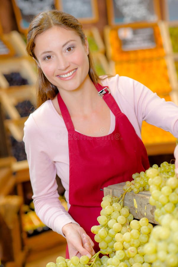 Female fruit stall worker stock image. Image of apron - 123600413
