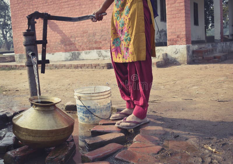 Female Gathering Water from a Water Supply Stock Image - Image of clear ...