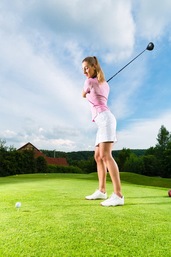 Female Golf Player on Course Doing Golf Swing Stock Image - Image of ...