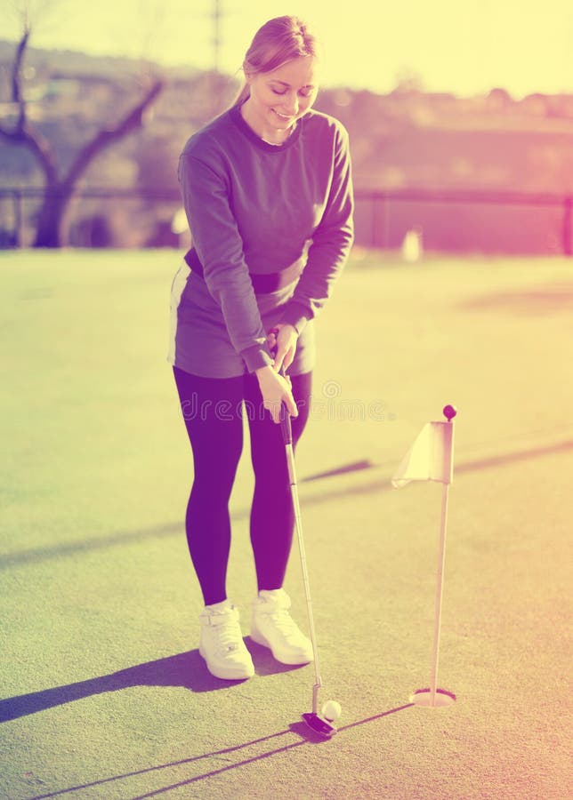 Female Golf Player Getting Ready To Hit Ball Stock Image - Image of ...