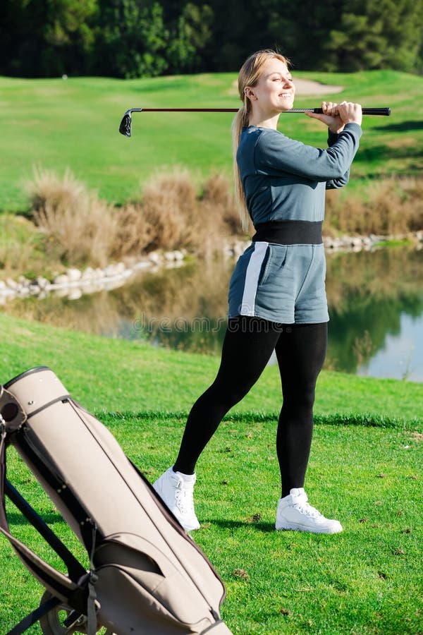 Female Golfer at Golf Course Stock Photo - Image of girl, balls: 90783152