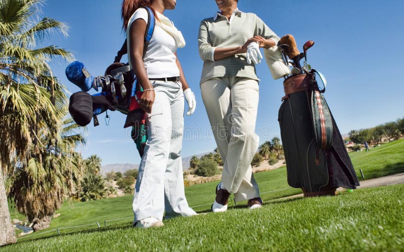 Golfers Walking on Golf Course Stock Image - Image of people, enjoyment ...