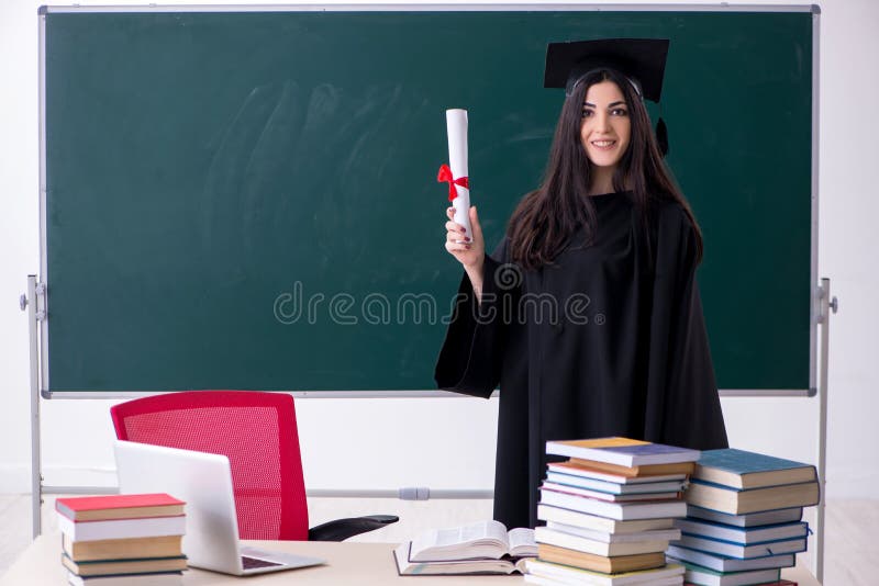 Female Graduate Student in Front of Green Board Stock Photo - Image of ...
