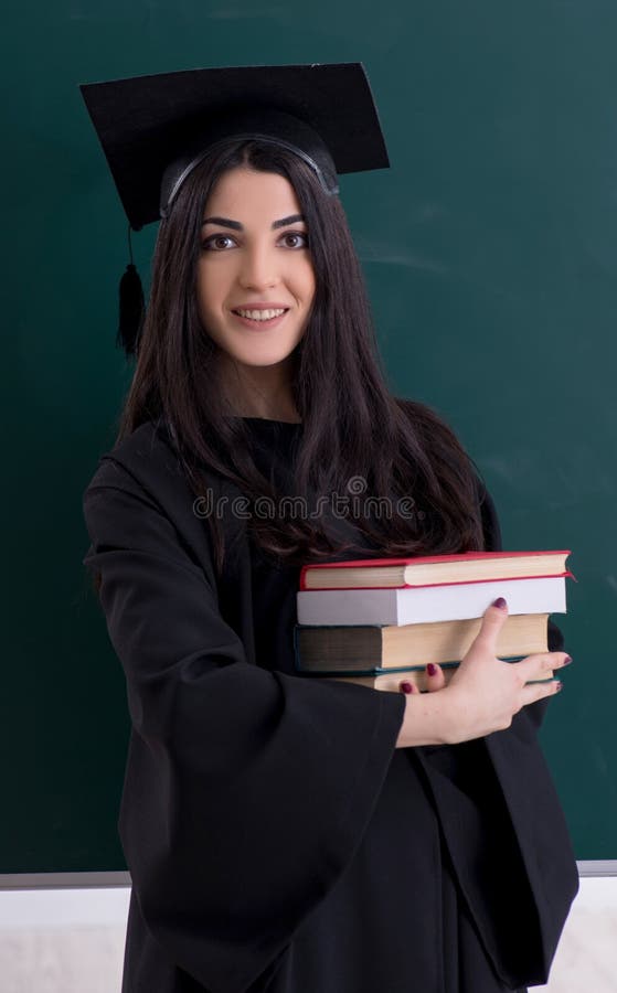Female Graduate Student in Front of Green Board Stock Image - Image of ...