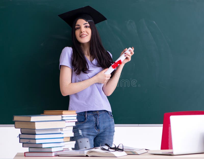 Female Graduate Student in Front of Green Board Stock Photo - Image of ...