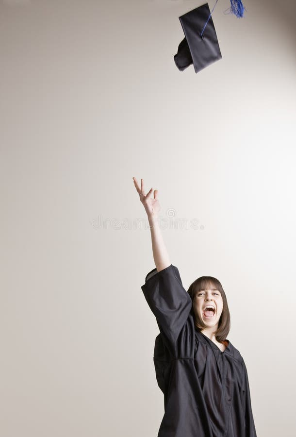Female Graduate Throwing Cap into the Air Stock Photo - Image of color ...
