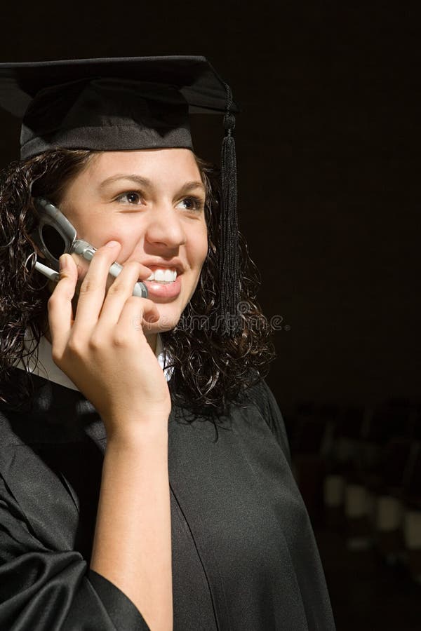 Female Graduate Using a Cellular Phone Stock Image - Image of ...