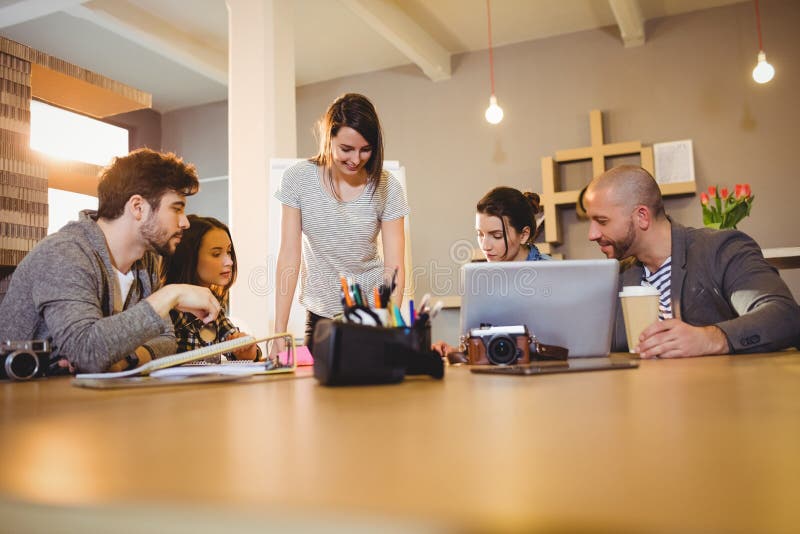 Female Graphic Designer Having Discussion with Coworkers Stock Image ...