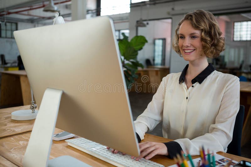 Female Graphic Designer Smiling while Using Desktop Pc Stock Image ...
