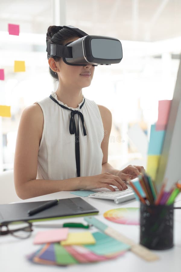 Female Graphic Designer Using Virtual Reality Headset while Working on ...