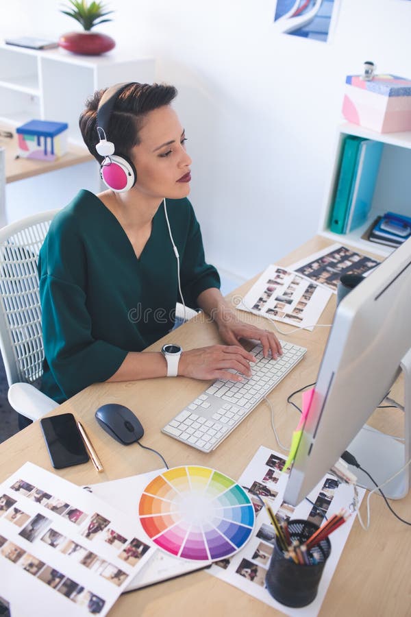 Female Graphic Designer Working on Computer at Desk Stock Photo - Image ...