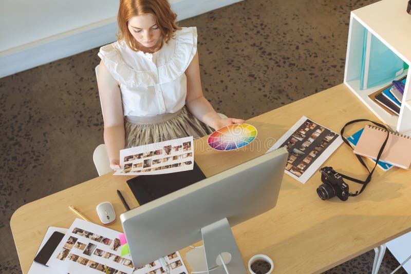 Female Graphic Designer Working at Desk in Office Stock Image - Image ...