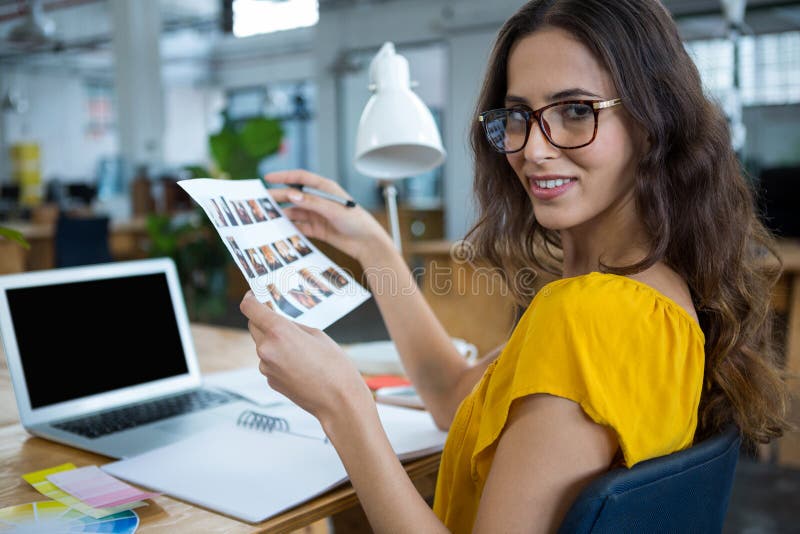 Female Graphic Designer Working at Desk Stock Photo - Image of notebook ...