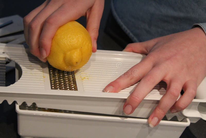Grating a Lemon stock image. Image of technology, lemon - 142231967