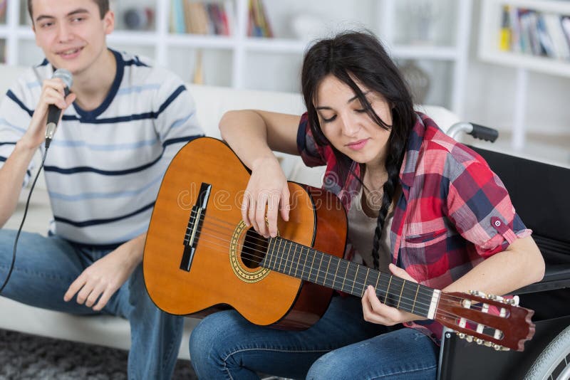 Female Guitarist Male Singer Stock Photo - Image of tune, music: 101438350