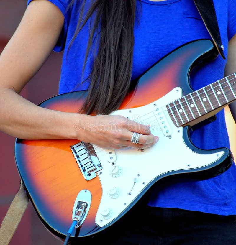 Female Guitarist Performing. Stock Photo - Image of strings, people ...