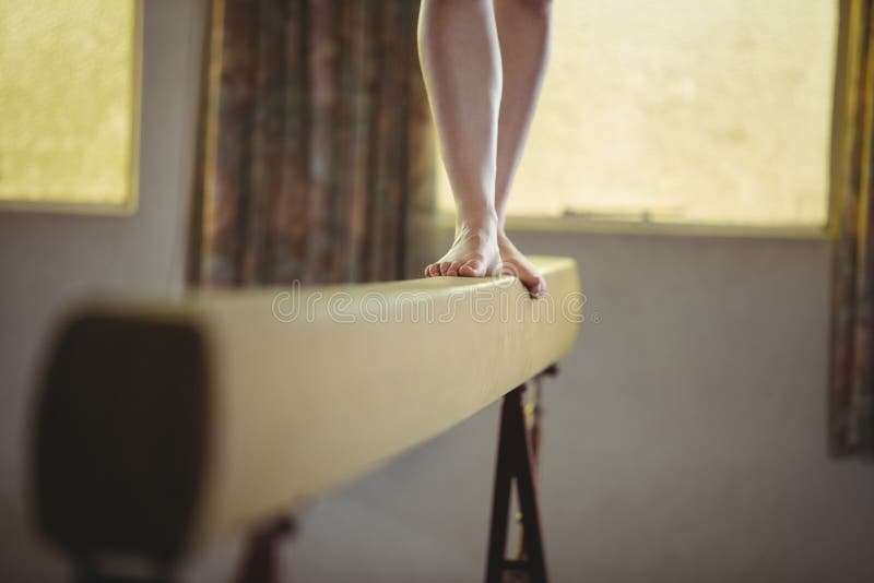 Female Gymnast Practicing Gymnastics on the Balance Beam Stock Image ...