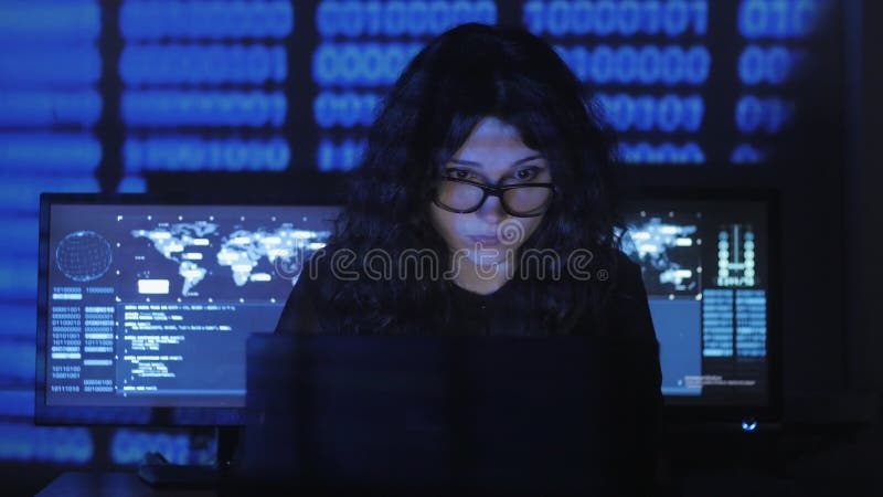 Bespectacled Woman Hacker Programmer Is Working On Computer In Cyber