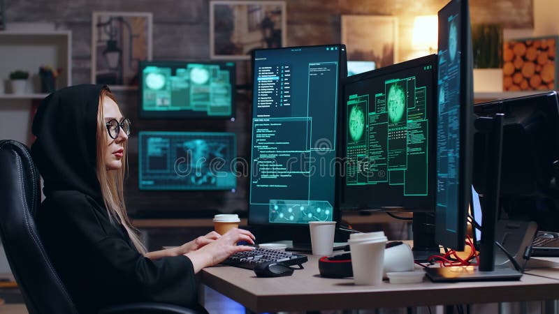 Female Hacker Wearing a Hoodie Using a Dangerous Virus Stock Photo ...