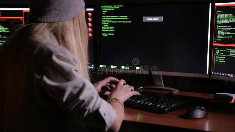 Female Hacker Sitting at Her Desk, Working. Police Siren in Window ...