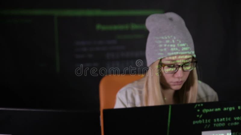Female Hacker Working at the Computer in Dark at Night. Binary Code ...