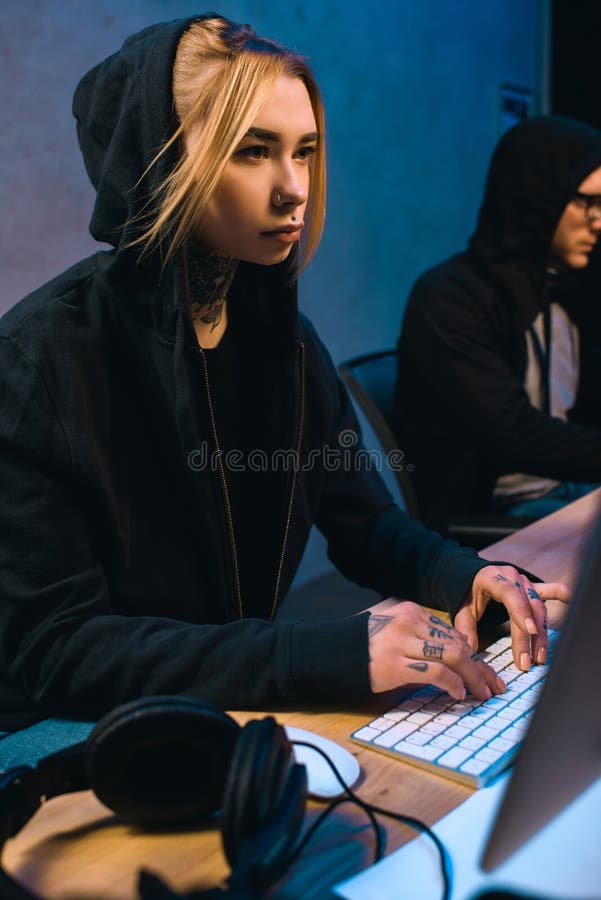 Female Hacker Working on New Malware with Accomplice Stock Photo ...