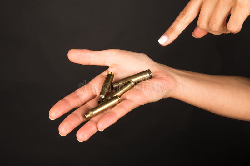 Female hand with bullets editorial stock image. Image of killing ...