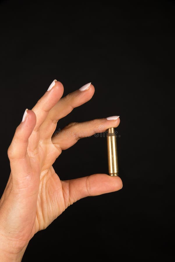 Female hand with bullets editorial stock image. Image of dangerous ...