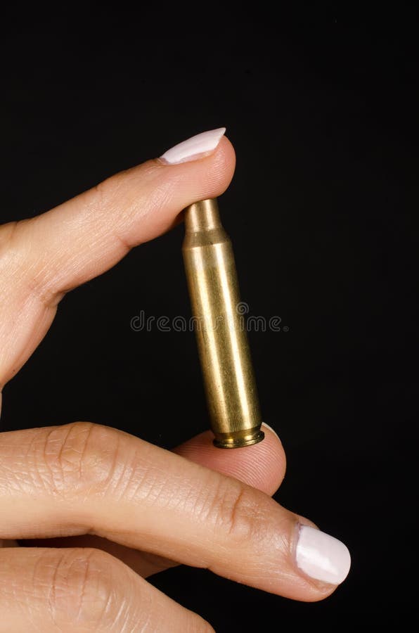 Female hand with bullets stock image. Image of studio - 145792787