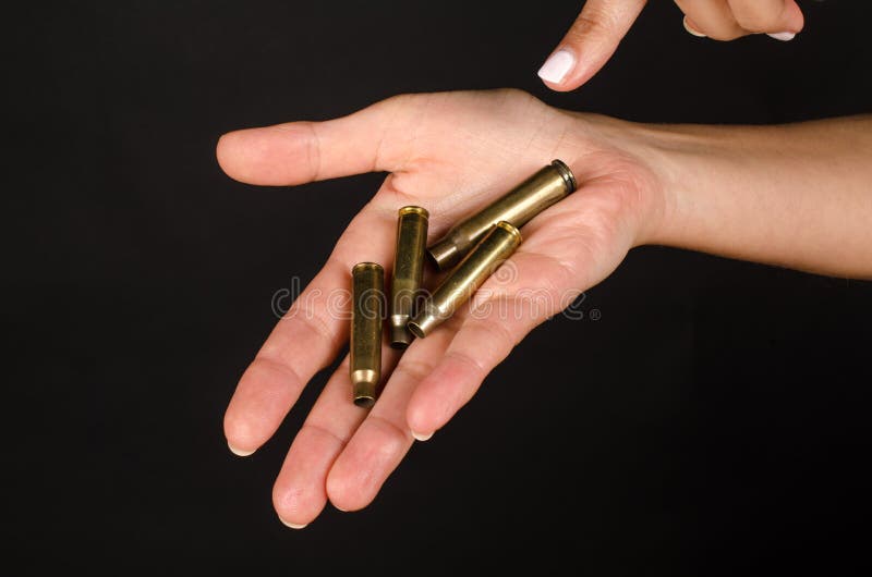 Female hand with bullets stock image. Image of concept - 145792815