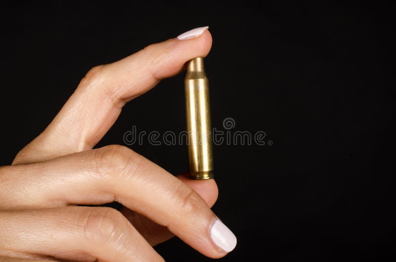 Female hand with bullets stock photo. Image of space - 151704492