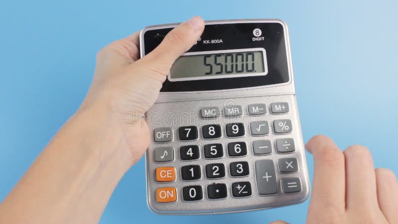 A Female Hand is Doing Some Calculations on a Calculator Close-up on a ...